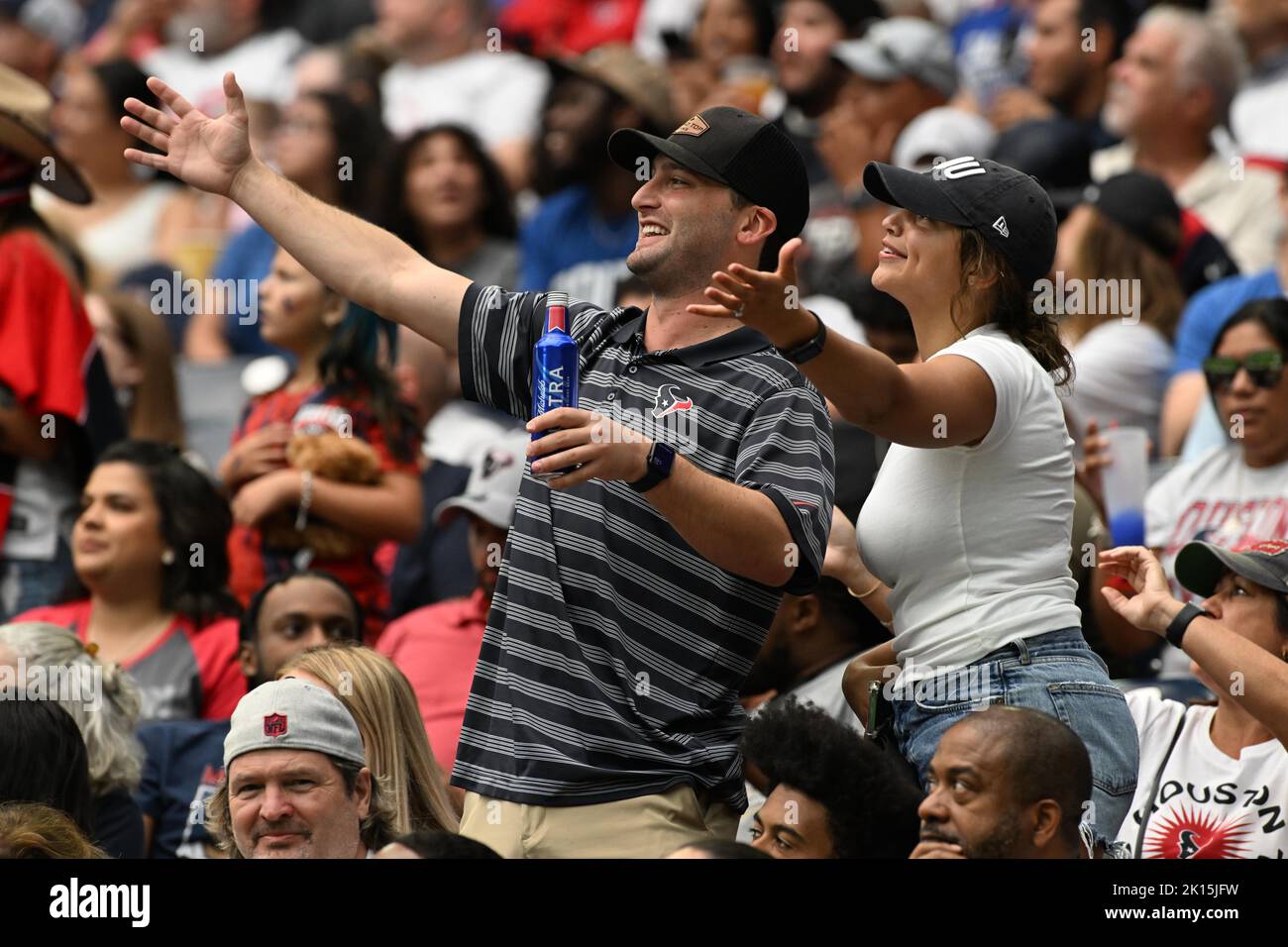 Houston Texas fans during a sing-a-long during the NFL football game ...