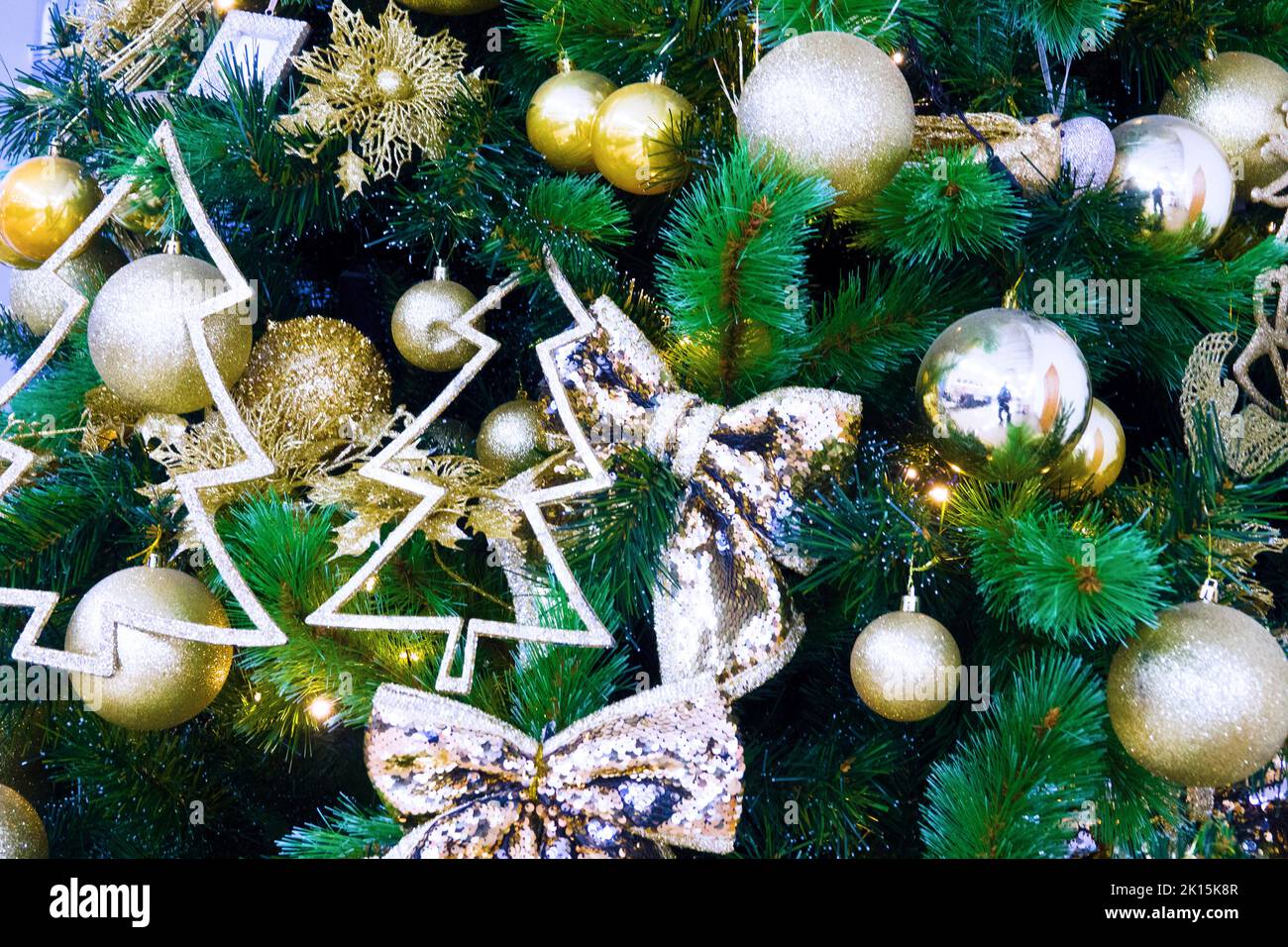A section of a New Year's Christmas tree with toys and illumination on ...