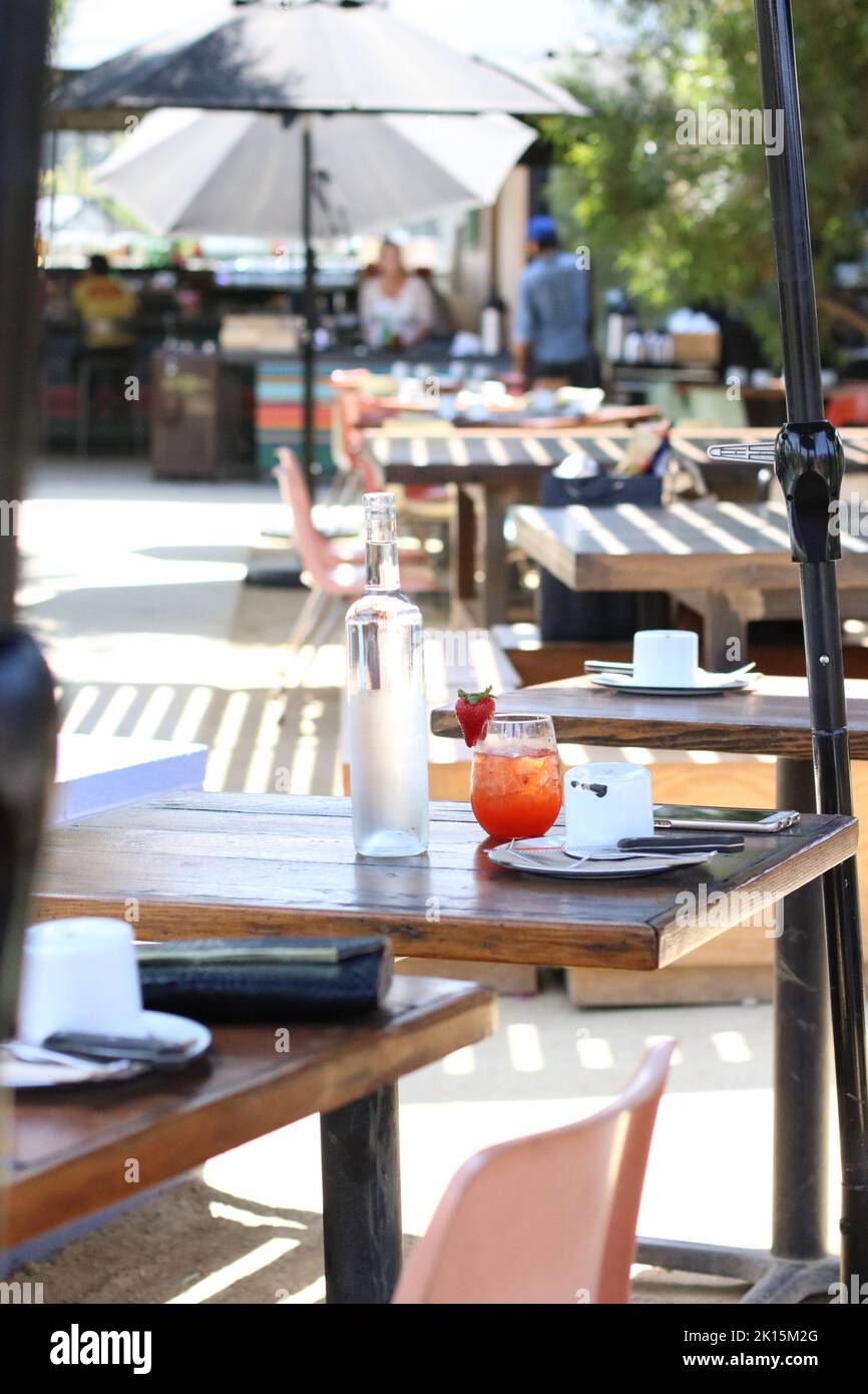 Umbrella tables outdoor seating hi-res stock photography and images - Alamy