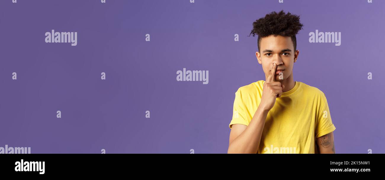 Close-up portrait of funny and unappropriate young hispanic teenage guy ...