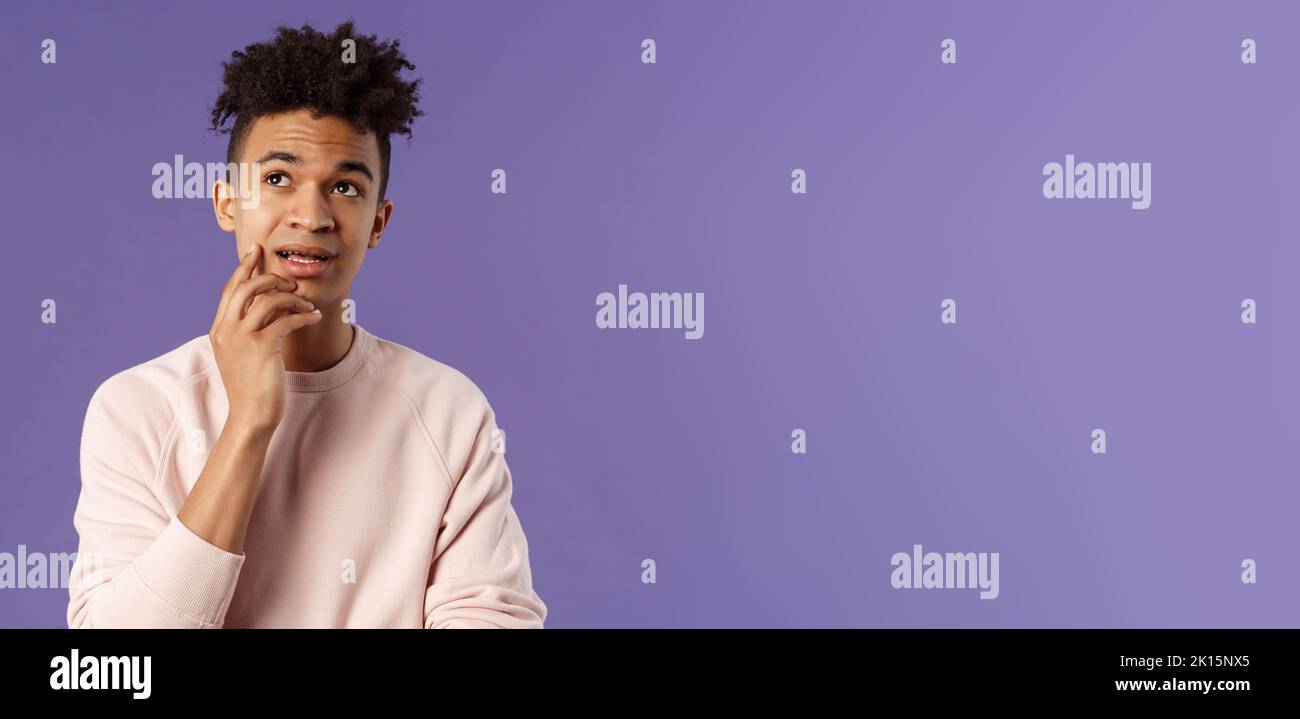 Waist-up portrait of thoughtful unsure young hispanic male student ...