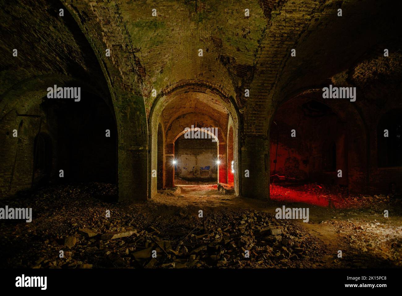 Dark corridor of old ancient abandoned red brick ruined historical ...