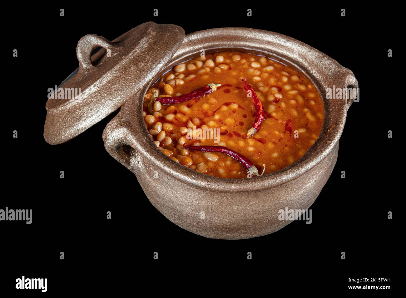 Turkish food Kuru fasulye (navy beans ) in casserole pot on the table ...