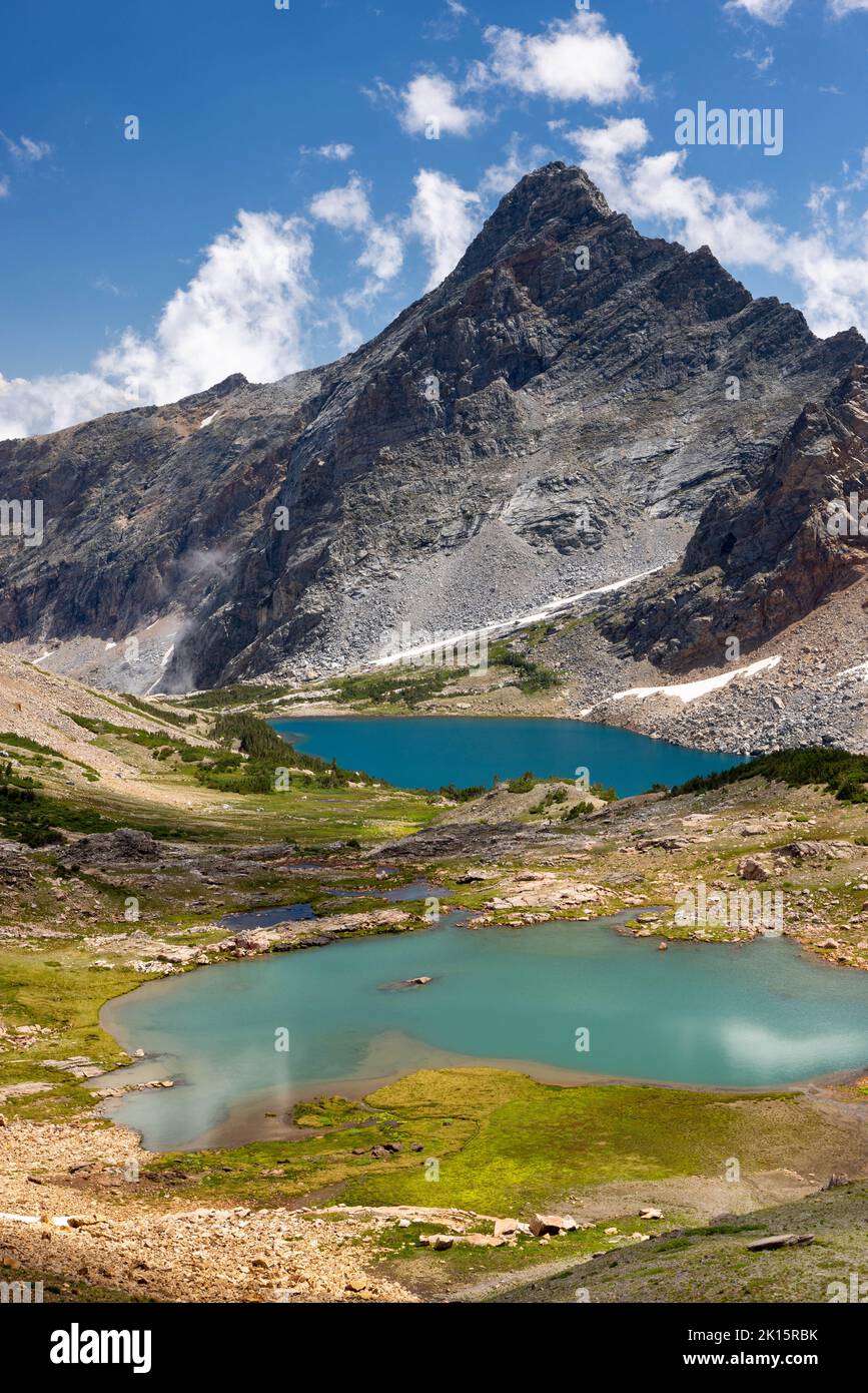 Kit and Snowdrift Lakes resting below the peak of Mount Wister at the ...