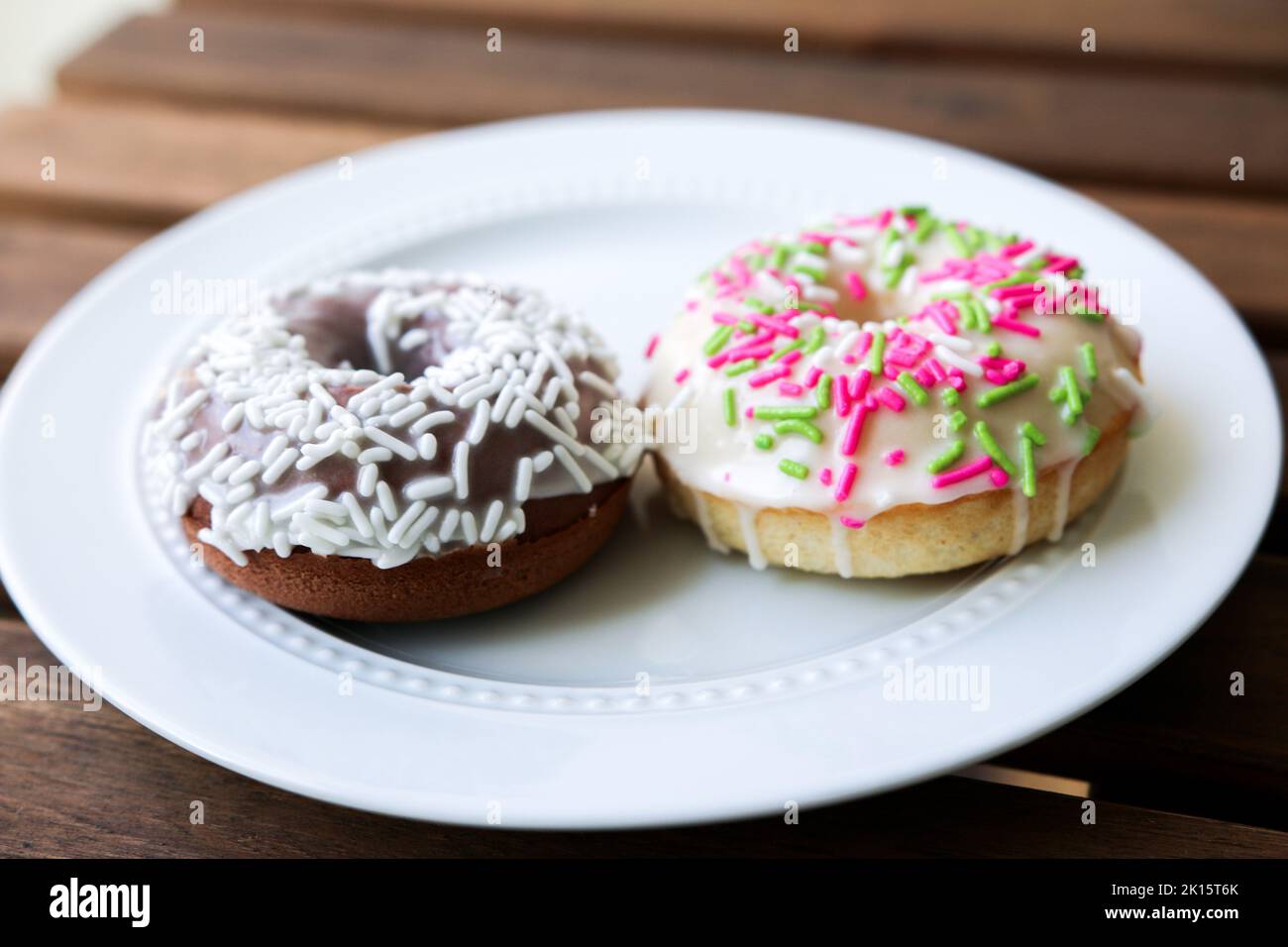 Homemade iced doughnuts with jimmies Stock Photo - Alamy