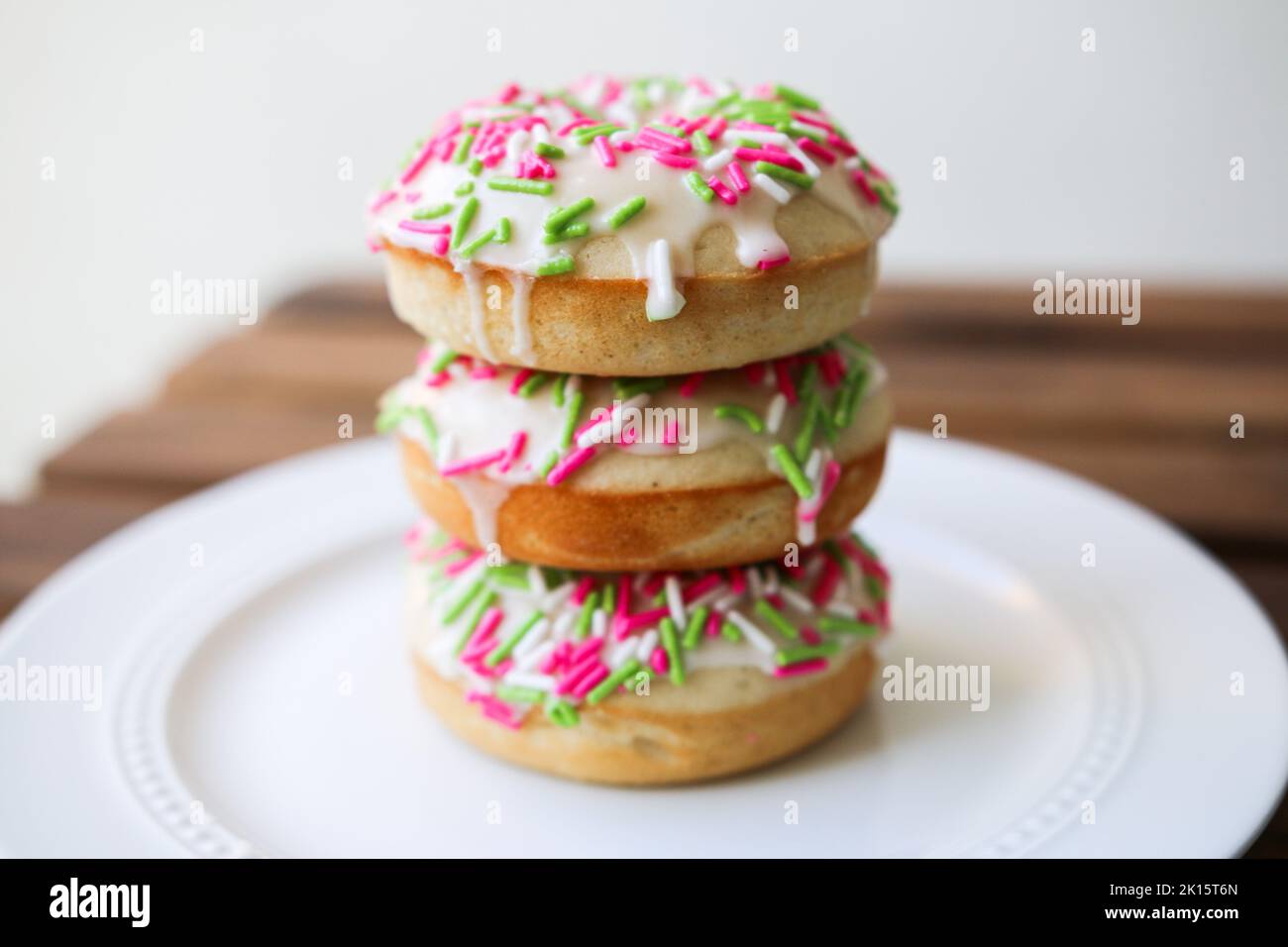 Homemade iced doughnuts with jimmies Stock Photo - Alamy