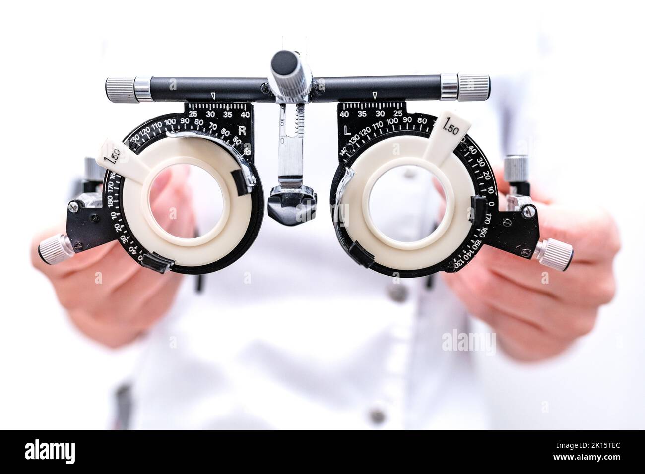 From above of crop unrecognizable ophthalmologist with optical trail ...