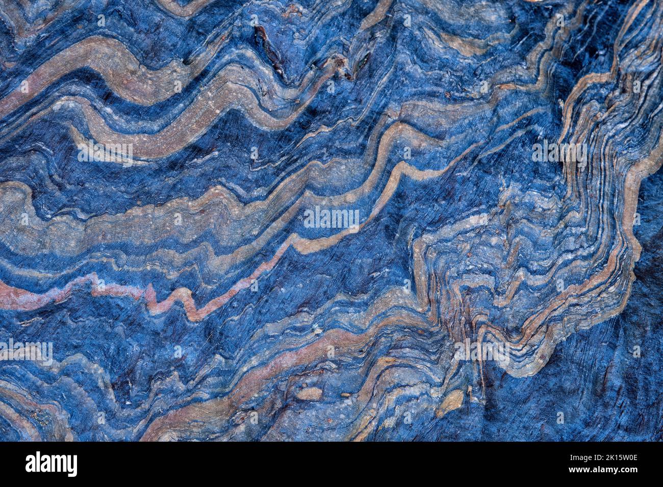 Textured background of smooth blue metamorphic stone with wavy abstract ...