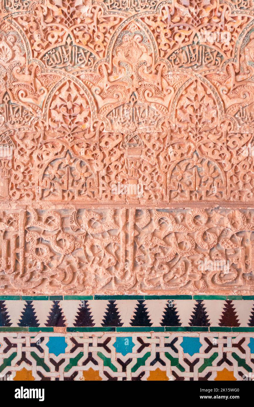 Colorful mosaic tiles forming geometric ornament under Arabic ...