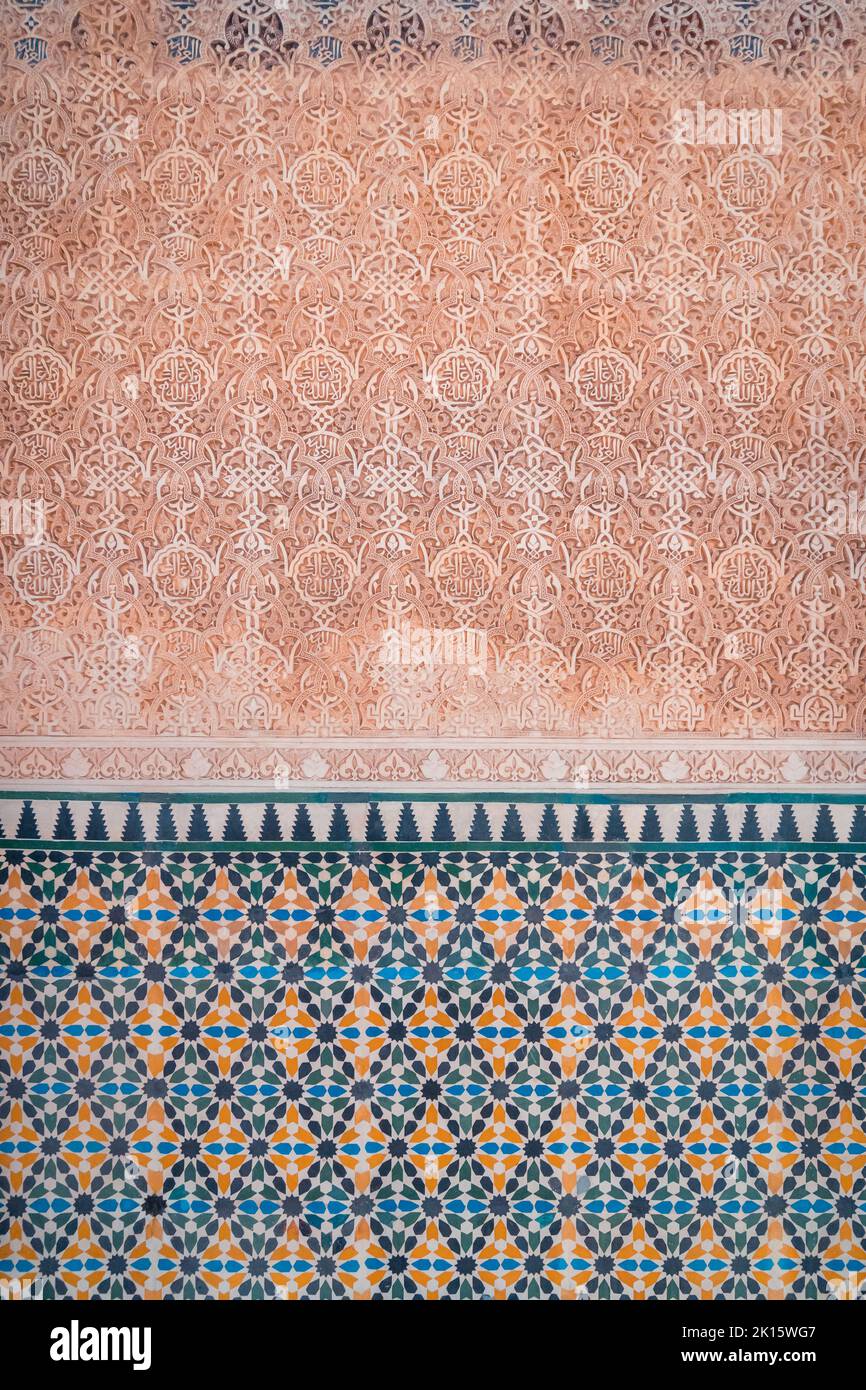 Colorful mosaic tiles forming geometric ornament under Arabic ...