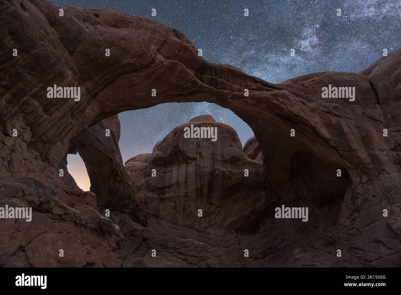 Breathtaking view of arid Arches National Park through rough Double ...