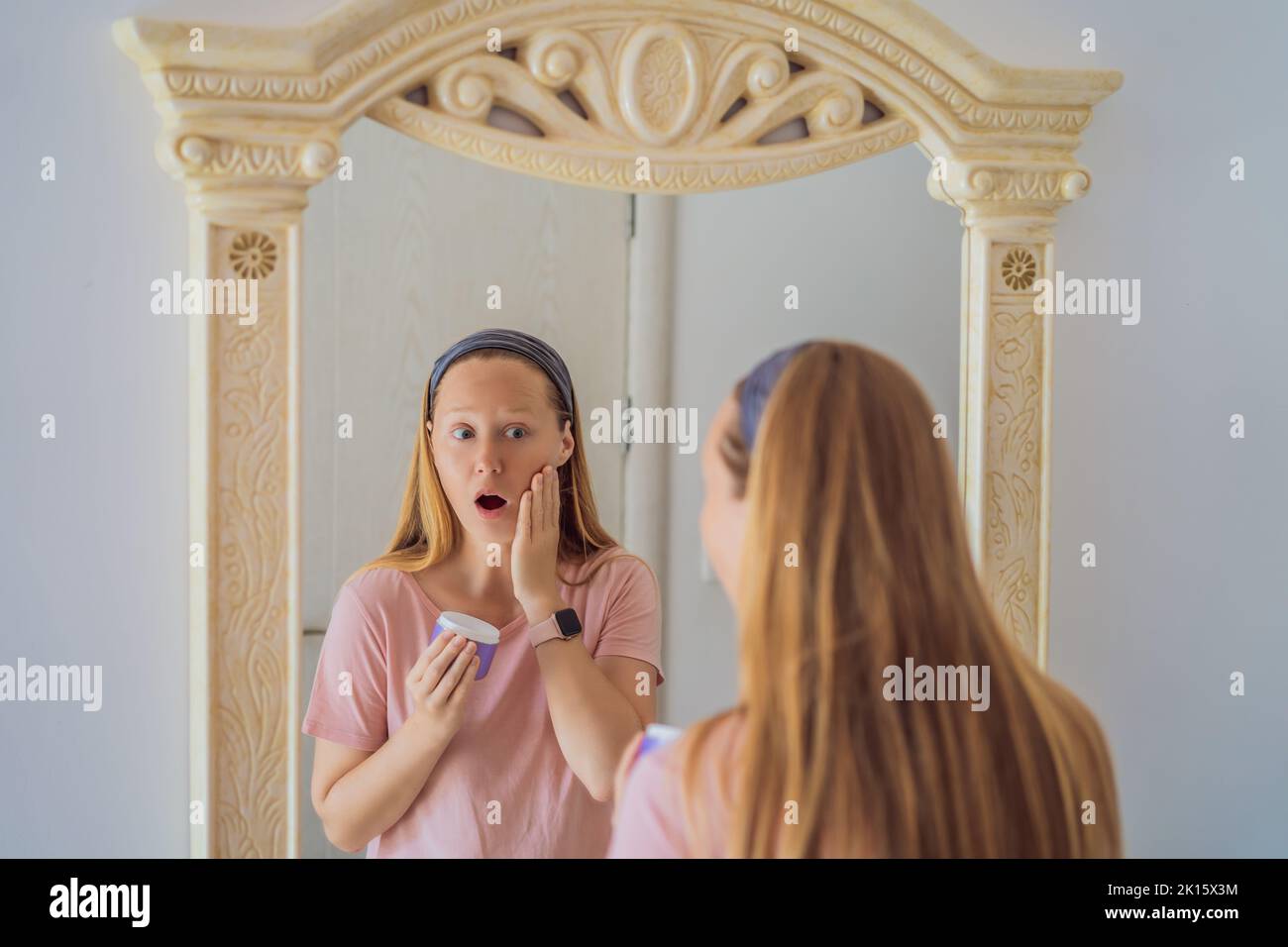 Happy girl excited with cosmetic effect of beauty care product ...