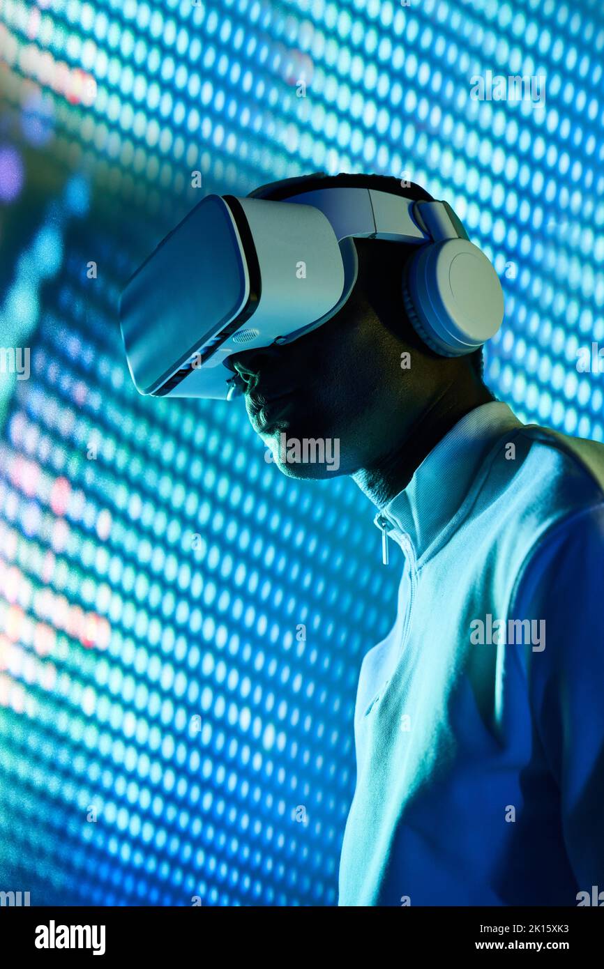From below side view of concentrated young African American in white t ...