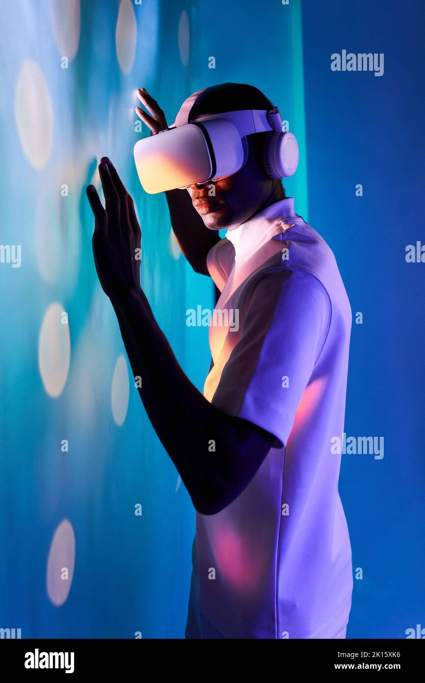 Side view of concentrated young African American in white t shirt and ...
