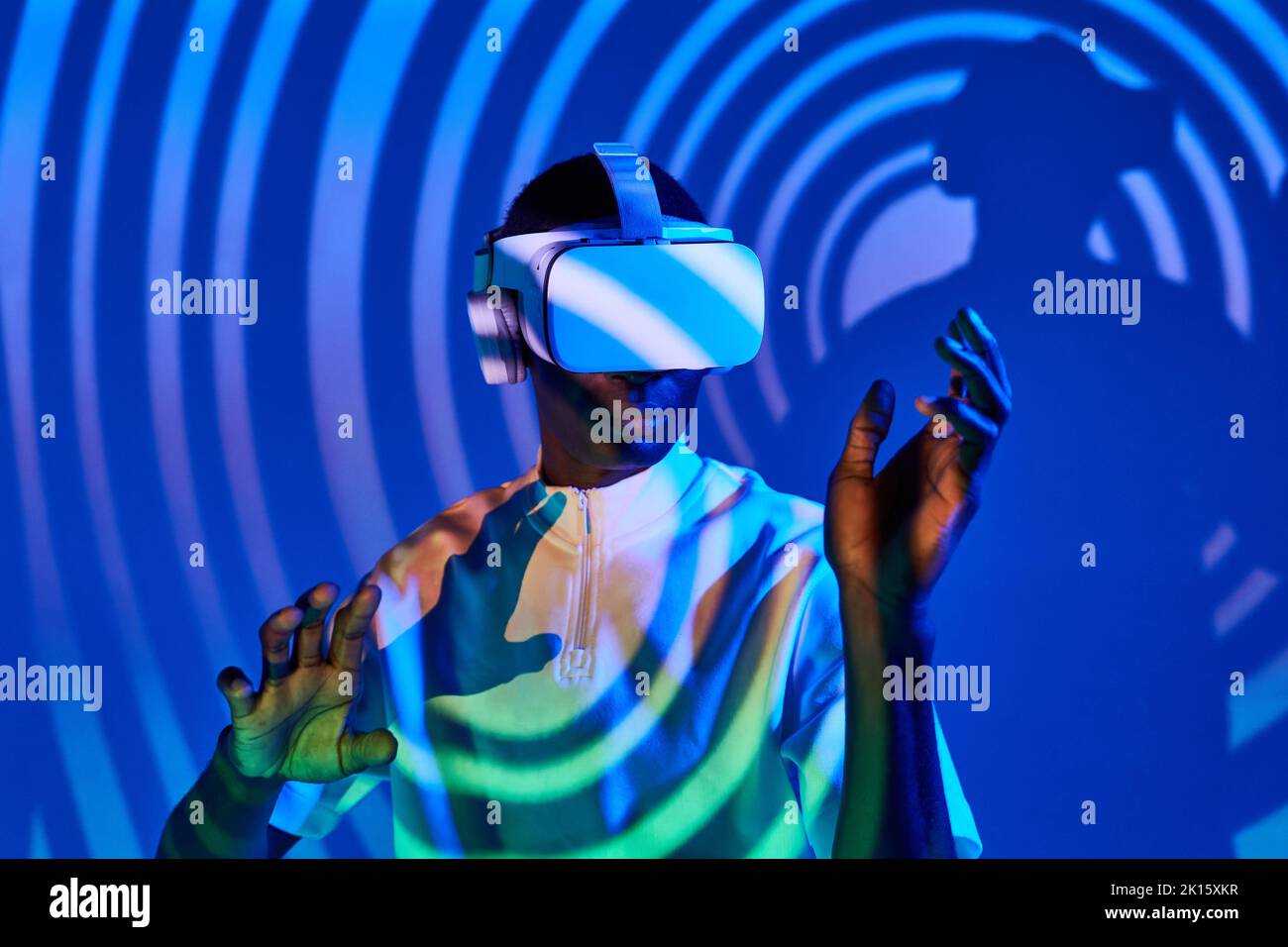 Stylish young African American male millennial in white t shirt raising ...