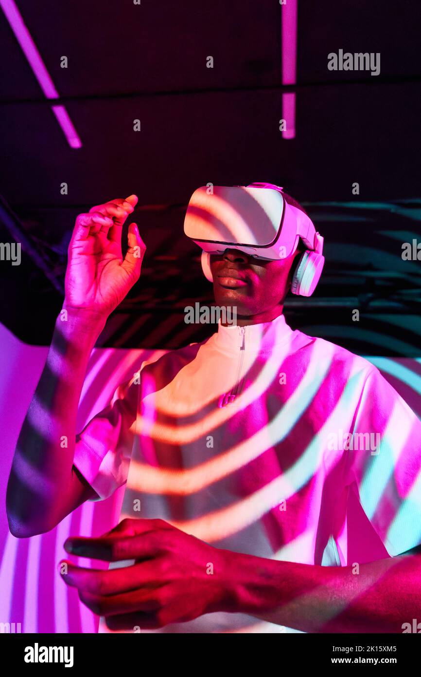 Stylish young African American male millennial in white t shirt raising ...