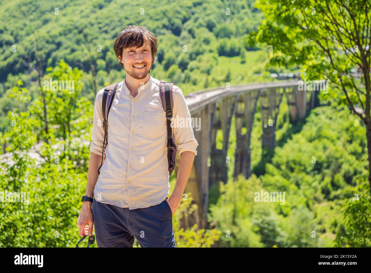 Montenegro. Man tourist in background of Dzhurdzhevich Bridge Over The ...
