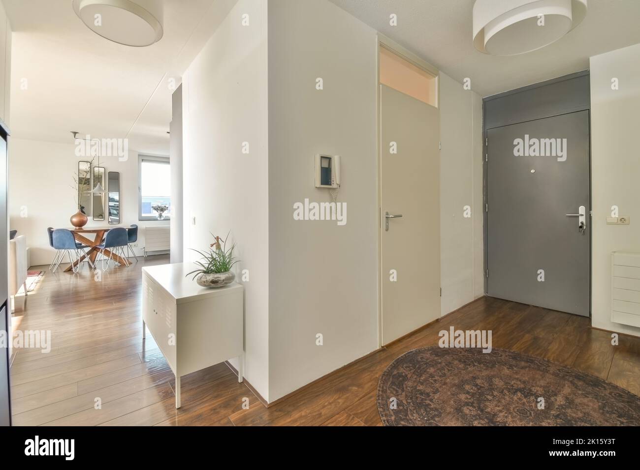 Interior passage way in bright modern house with parquet floor Stock Photo - Alamy