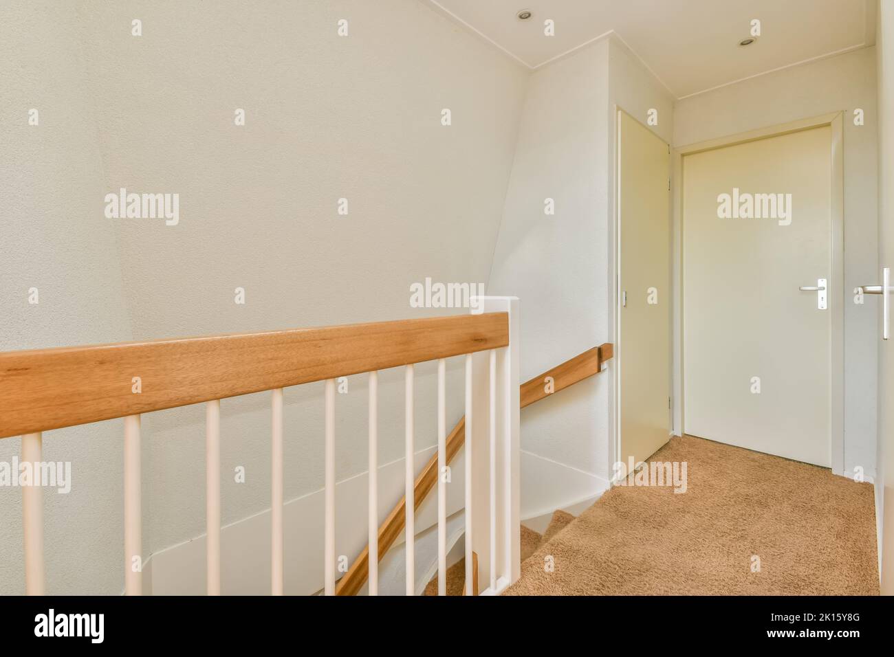 Interior of a house with stairs to an down floor in a bright ...