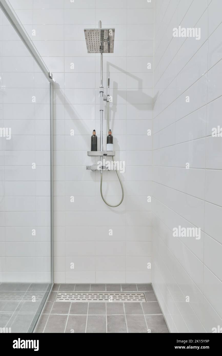 Interior of a modern shower with white walls Stock Photo - Alamy
