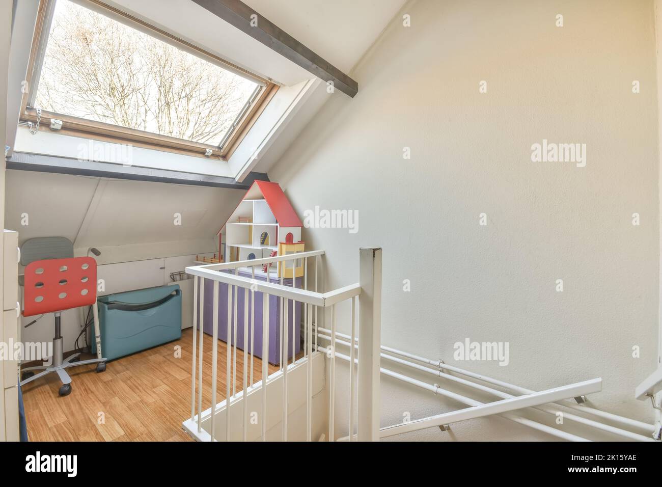 Interior of a house with stairs to an down floor in a bright ...