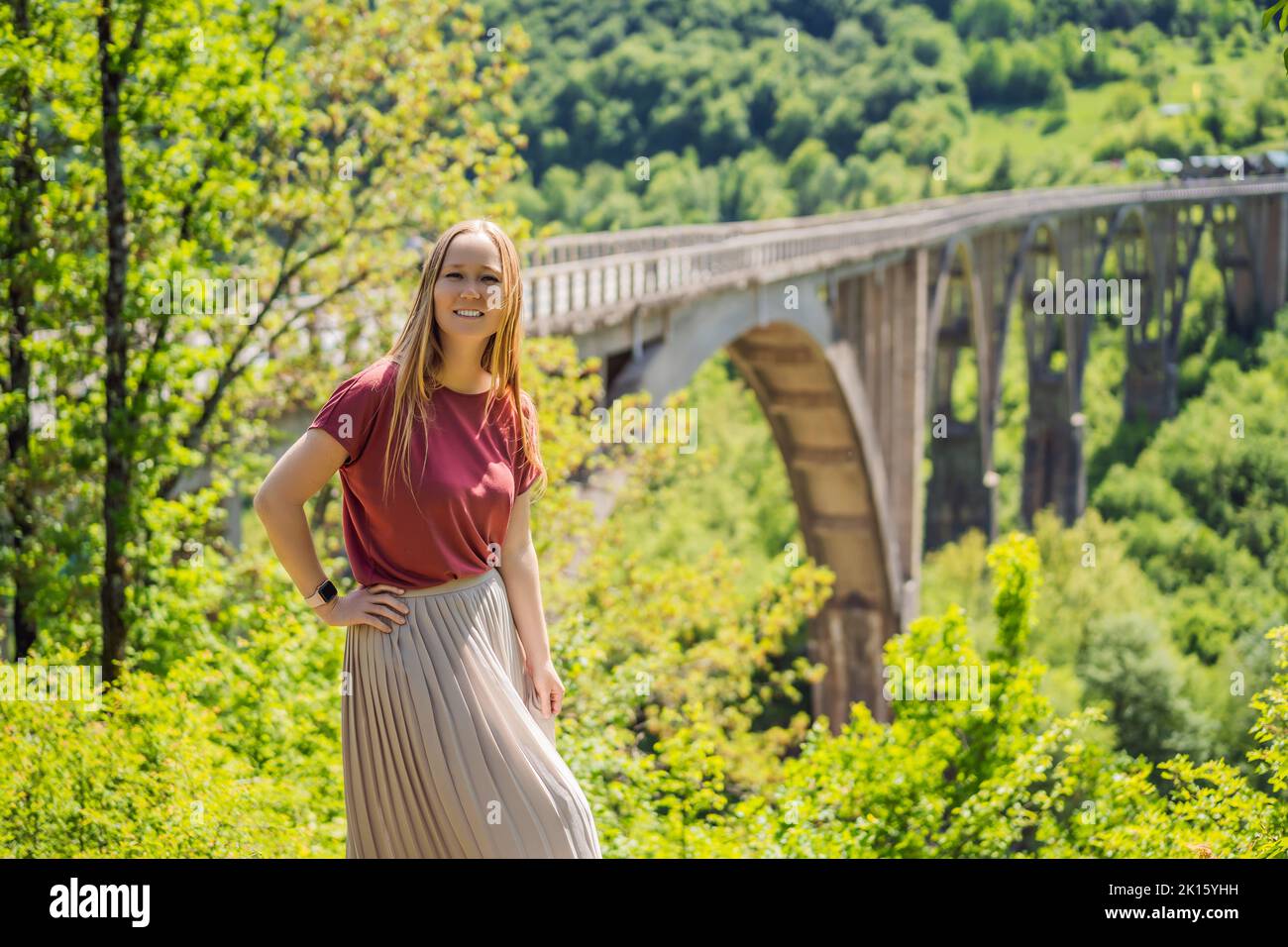 Montenegro. Woman tourist in background of Dzhurdzhevich Bridge Over ...