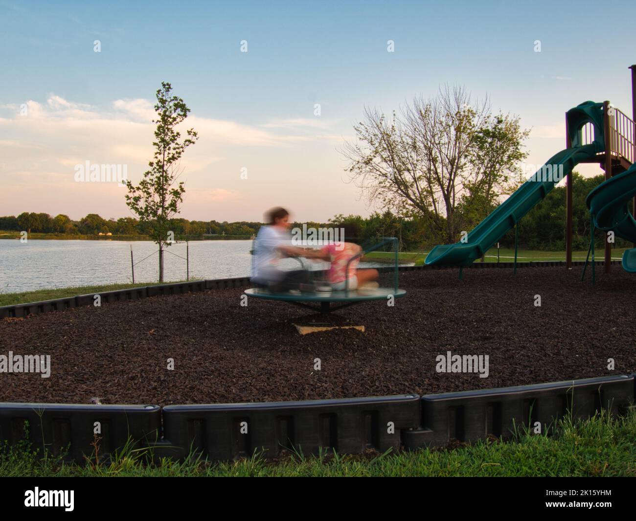 Children Spinning on Merry Go Round in Spring Hill Kansas Stock Photo ...