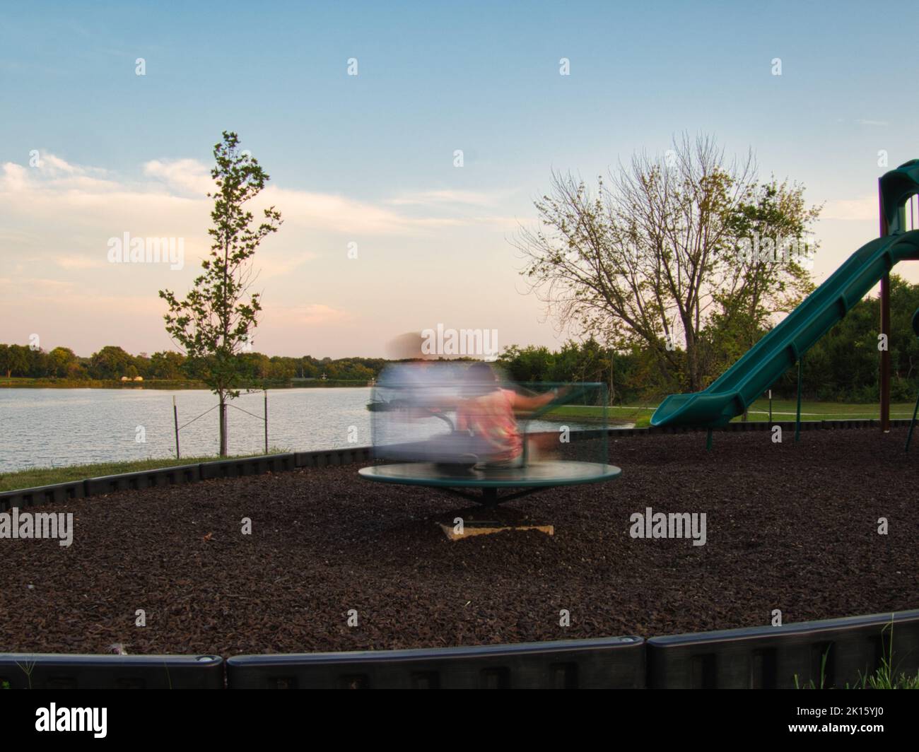 Children Spinning on Merry Go Round in Spring Hill Kansas Stock Photo ...