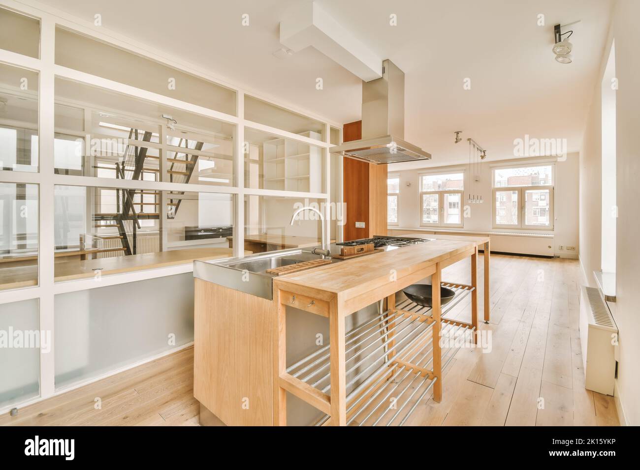 Counter with sink, stove and extraction bell placed in kitchen island ...