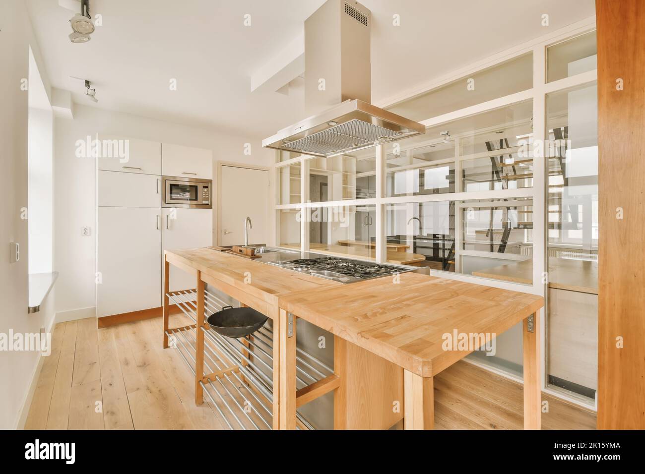 Counter with sink, stove and extraction bell placed in kitchen island ...