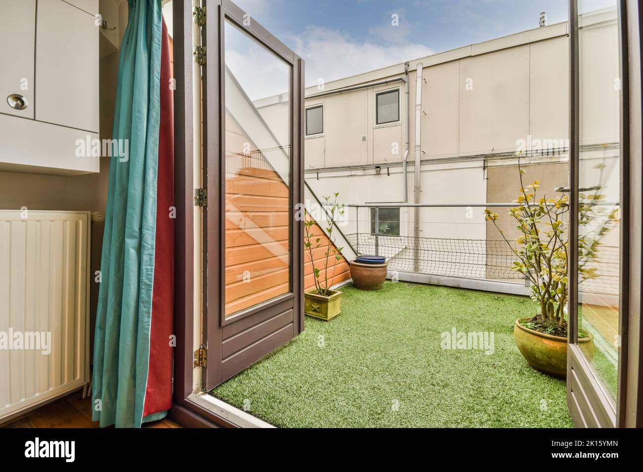 Terrace of typical residential building with tiled roof and windows ...
