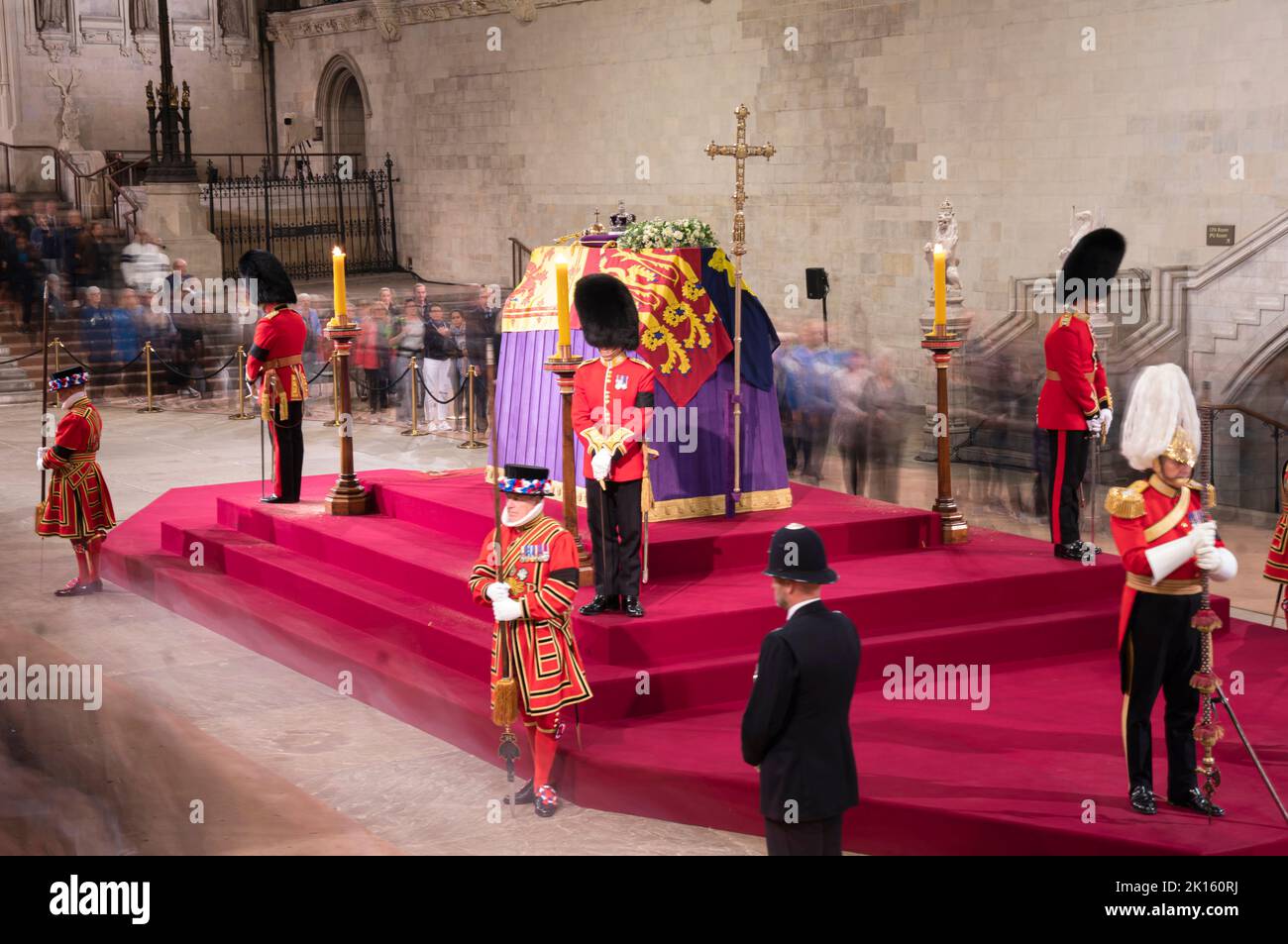 A long exposure photograph showing members of the public as they file ...
