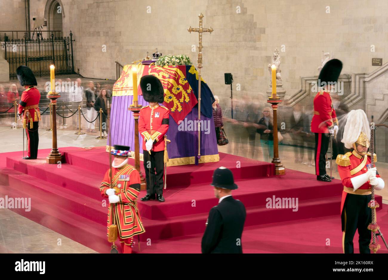 A long exposure photograph showing members of the public as they file ...