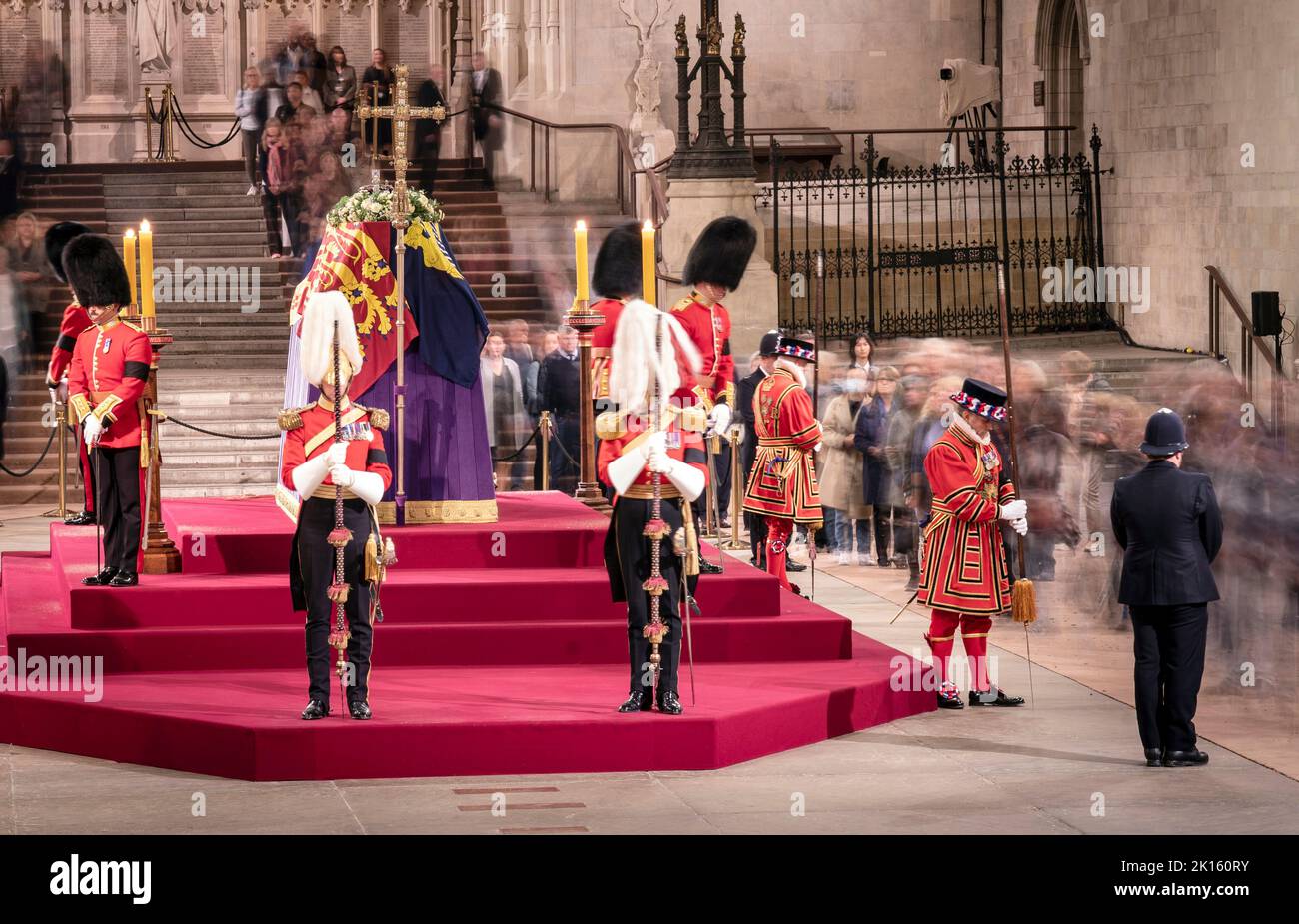 A long exposure photograph showing members of the public as they file ...