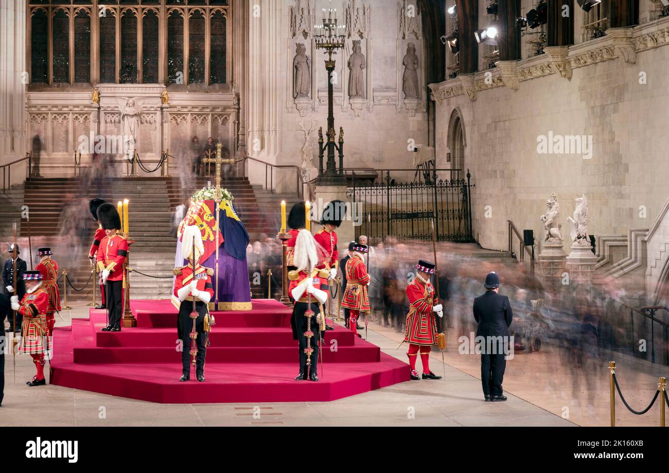 A long exposure photograph showing members of the public as they file ...