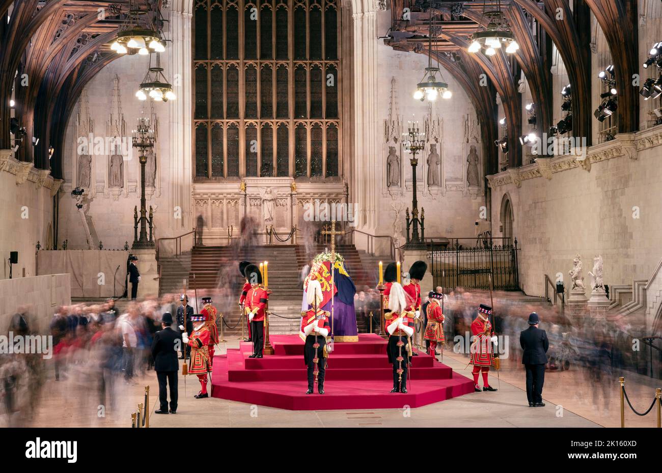 A long exposure photograph showing members of the public as they file ...