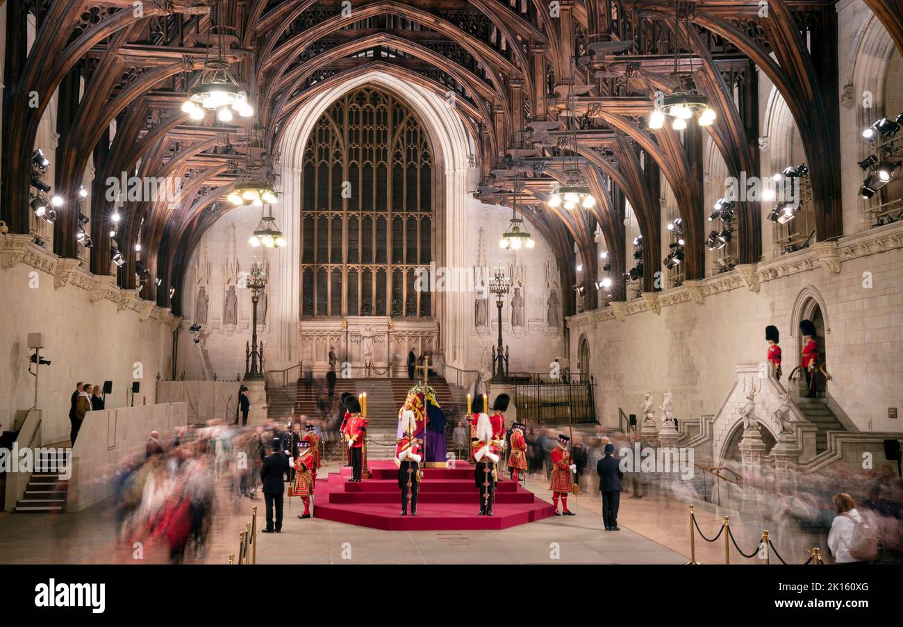 A long exposure photograph showing members of the public as they file ...