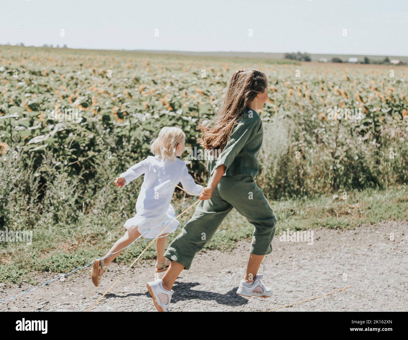 Back view kids running hi-res stock photography and images - Alamy