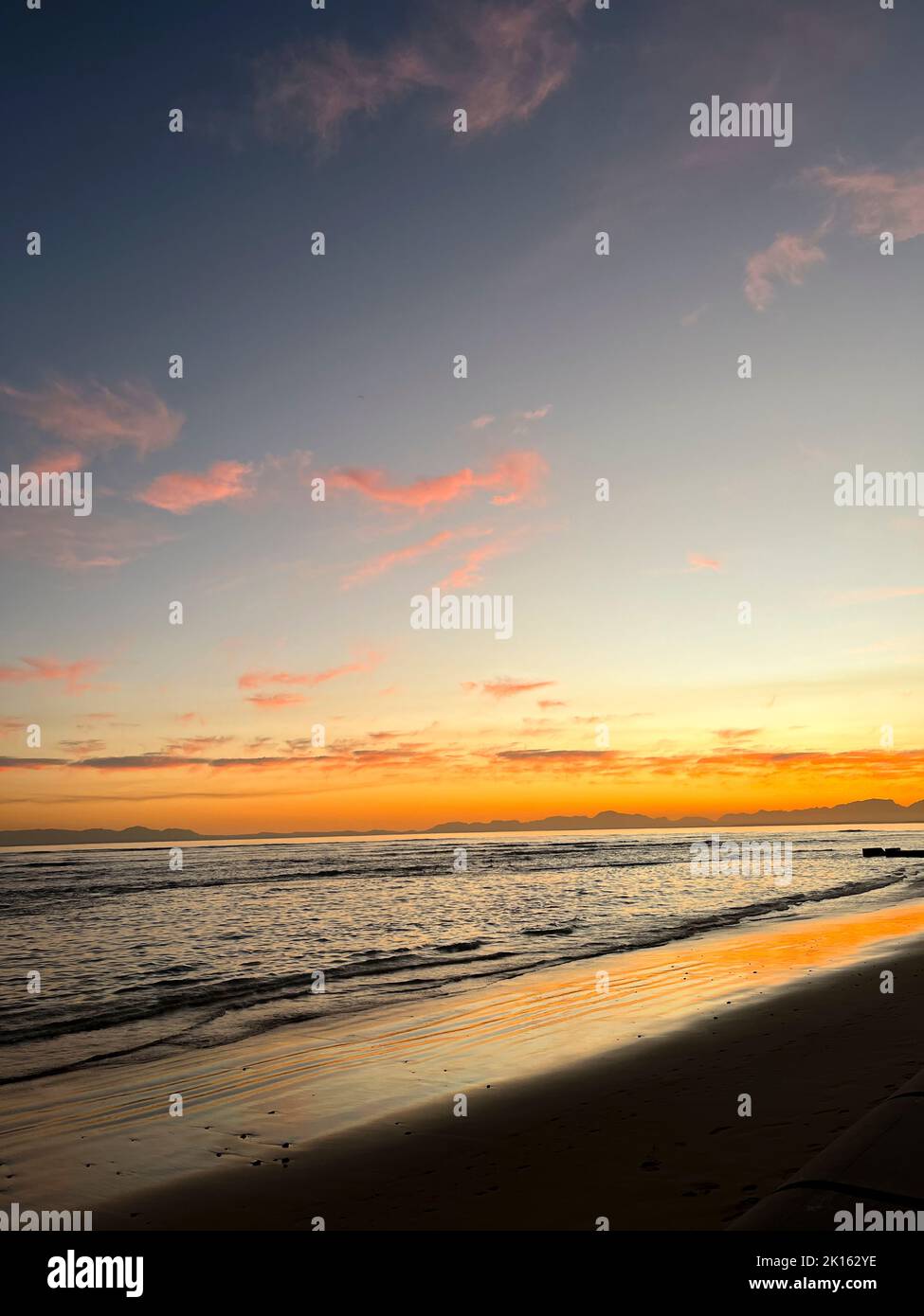 Multicolor sunset at the beach Stock Photo - Alamy