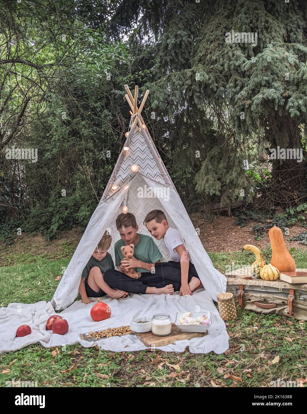 The children hid from the autumn rain in a teepee Stock Photo - Alamy