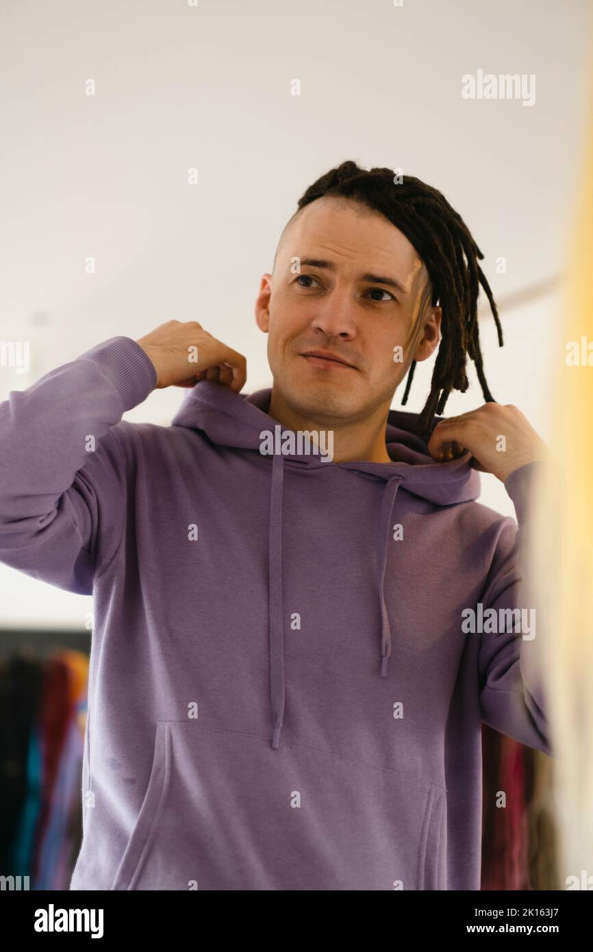 Young man looking in mirror hi-res stock photography and images - Alamy