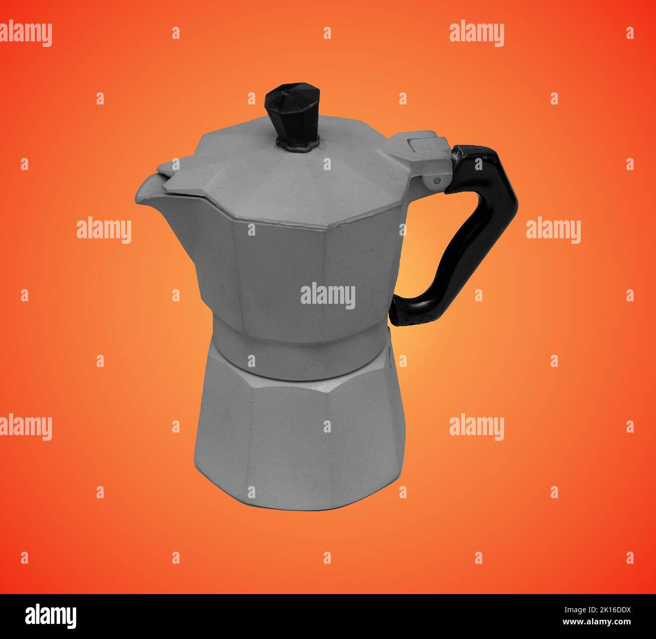 Traditional Italian metal espresso coffee pot isolated on orange ...