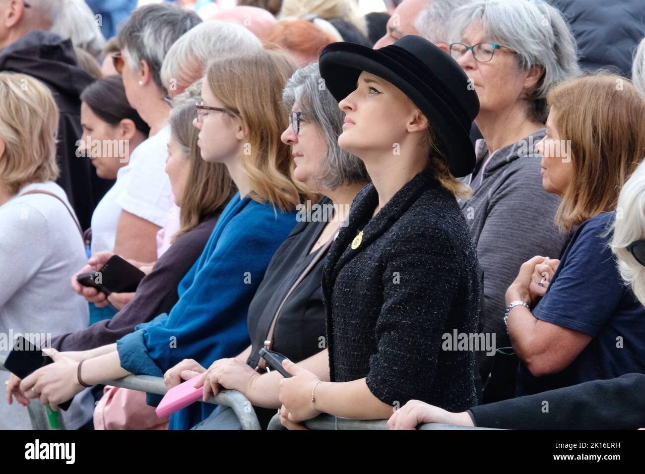 Mourners wait for the Queen's coffin procession to pass in Whitehall ...