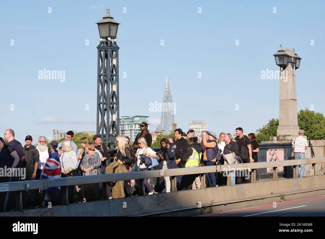 London, UK. The public queue to pay their respects the Queen as her ...