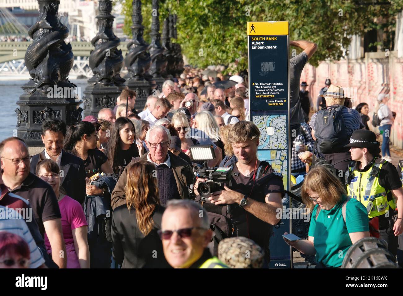 London, UK. The public queue to pay their respects the Queen as her ...