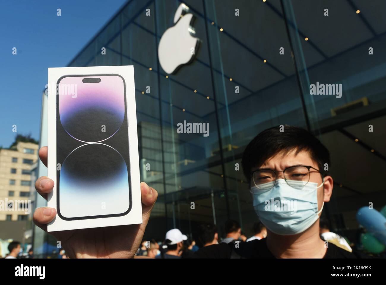 HANGZHOU, CHINA - SEPTEMBER 16, 2022 - A customer shows an Iphone14 he ...