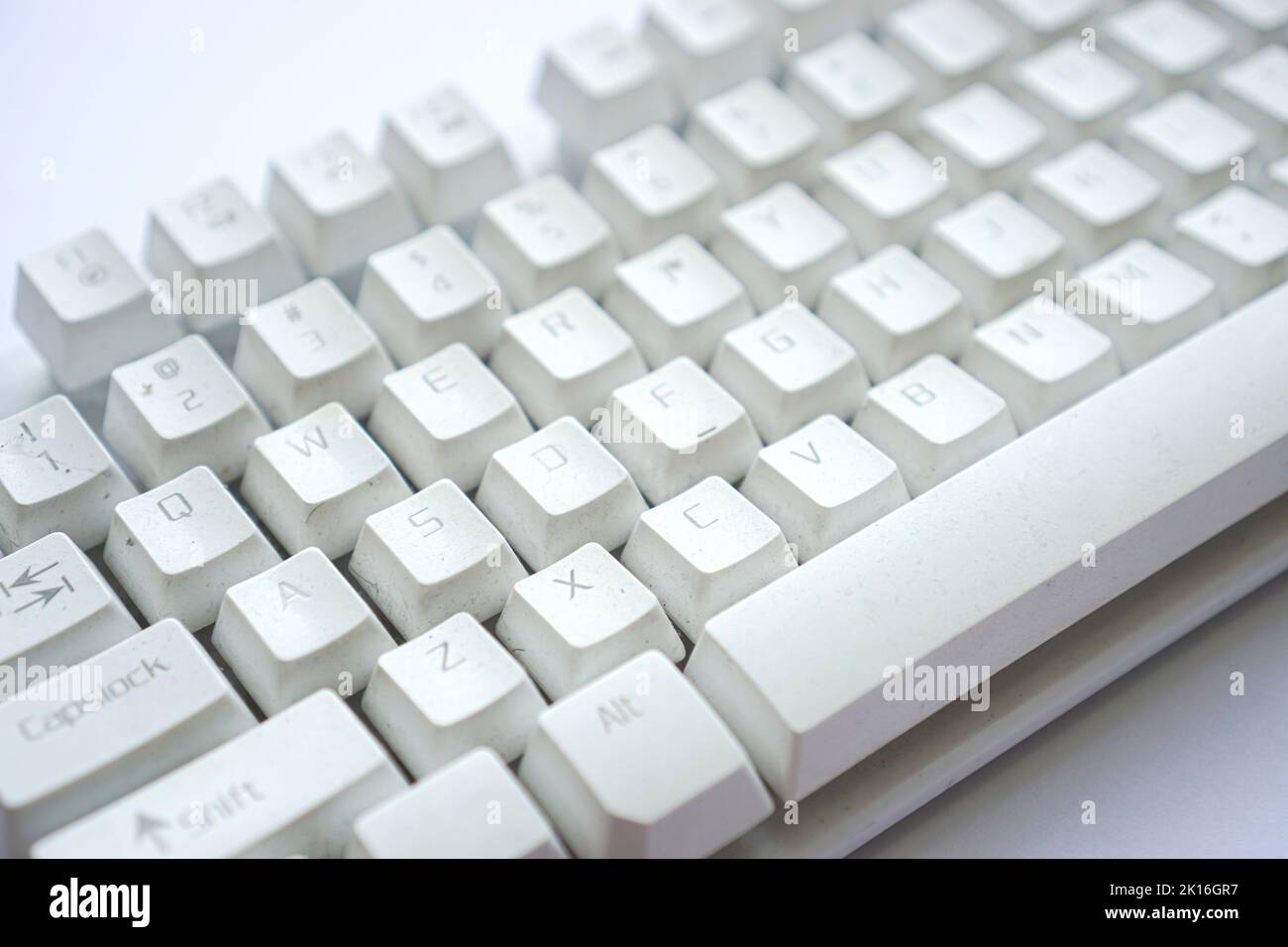 Used white computer keyboard that is not used until it gets dusty ...