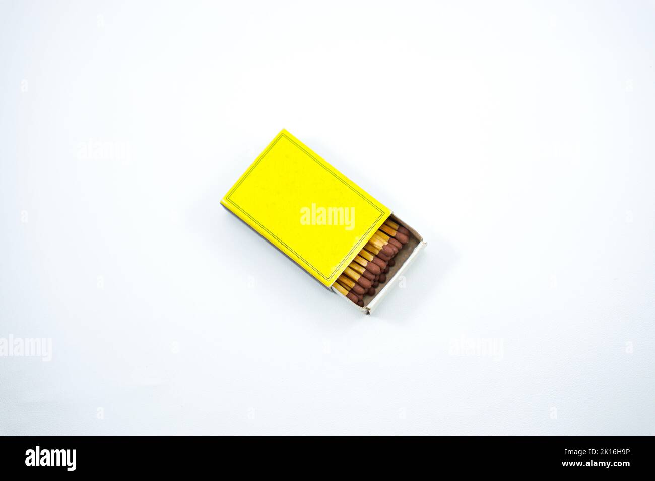 yellow box of matches isolated on white background Stock Photo - Alamy