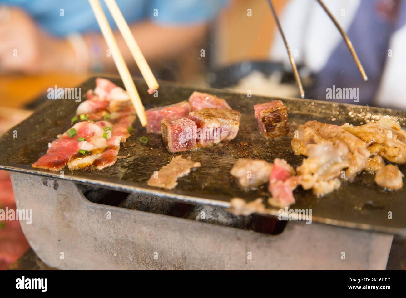 Dice beef and Striped calf beef on the pan and stove, focus selective ...