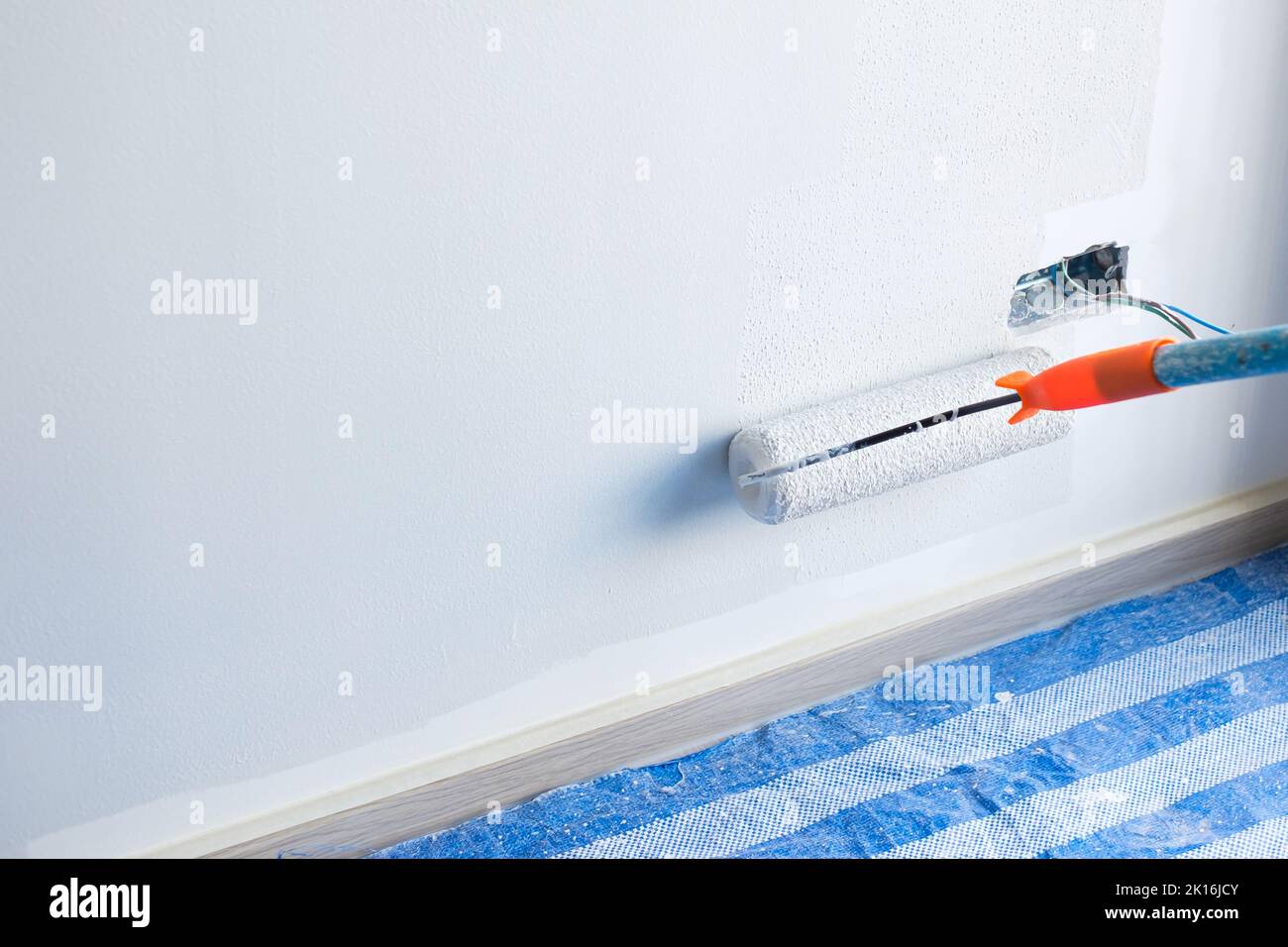 Professional painter rolling white paint hi-res stock photography and ...